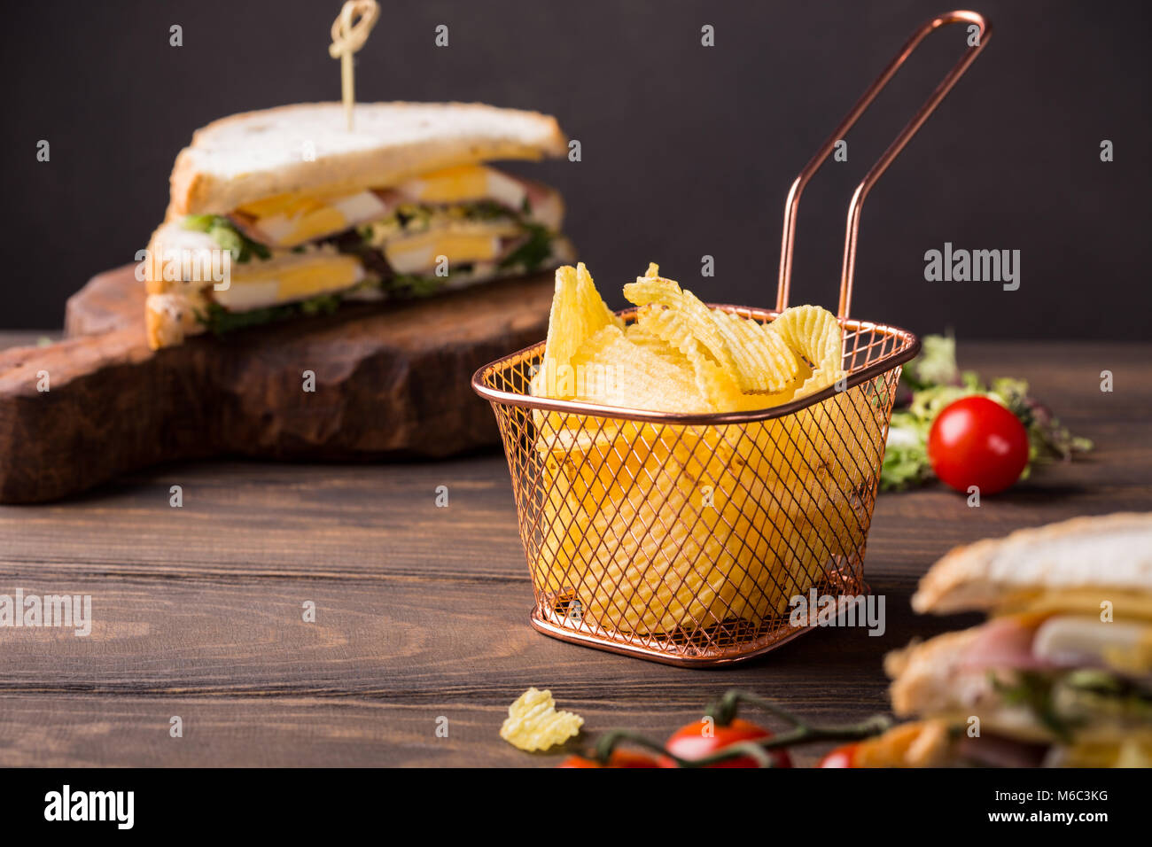 Crispy potato chips in copper basket Stock Photo - Alamy