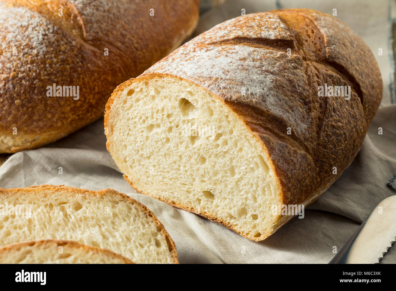Whole Grain White French Bread Cut into Slices Stock Photo - Alamy