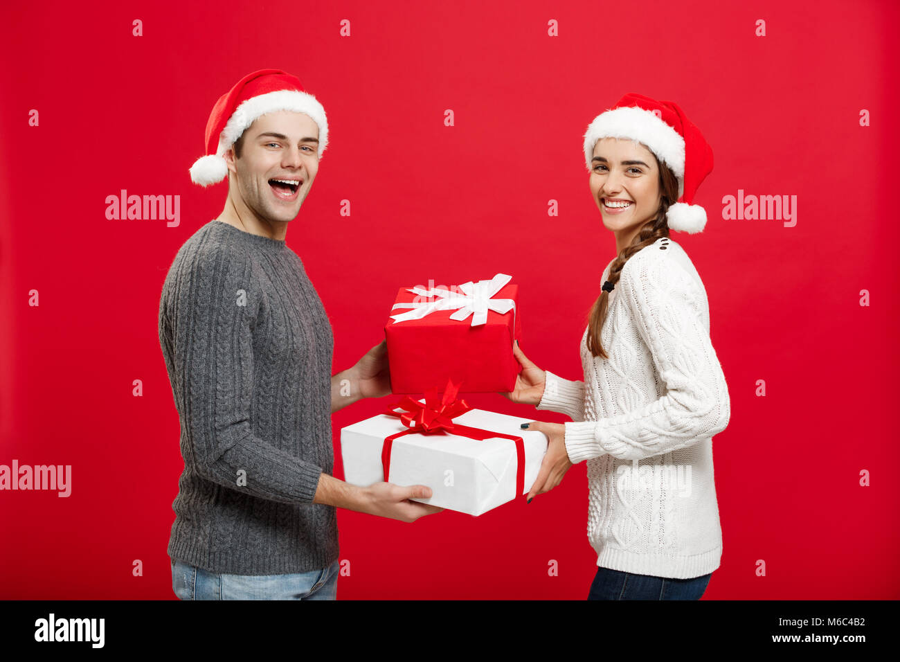 Couple giving each other gifts hi-res stock photography and images - Alamy