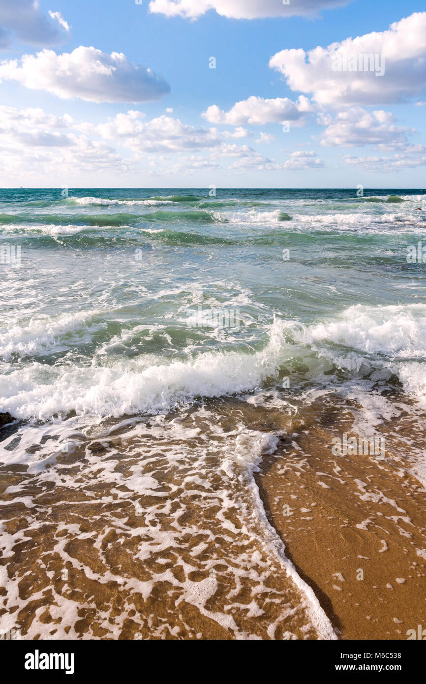 crystal clear sea and frothy waves on the beaches of Palermo in Sicily ...