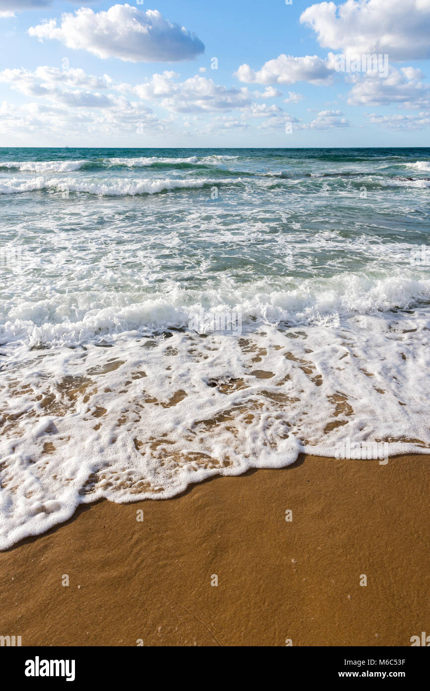 crystal clear sea and frothy waves on the beaches of Palermo in Sicily ...
