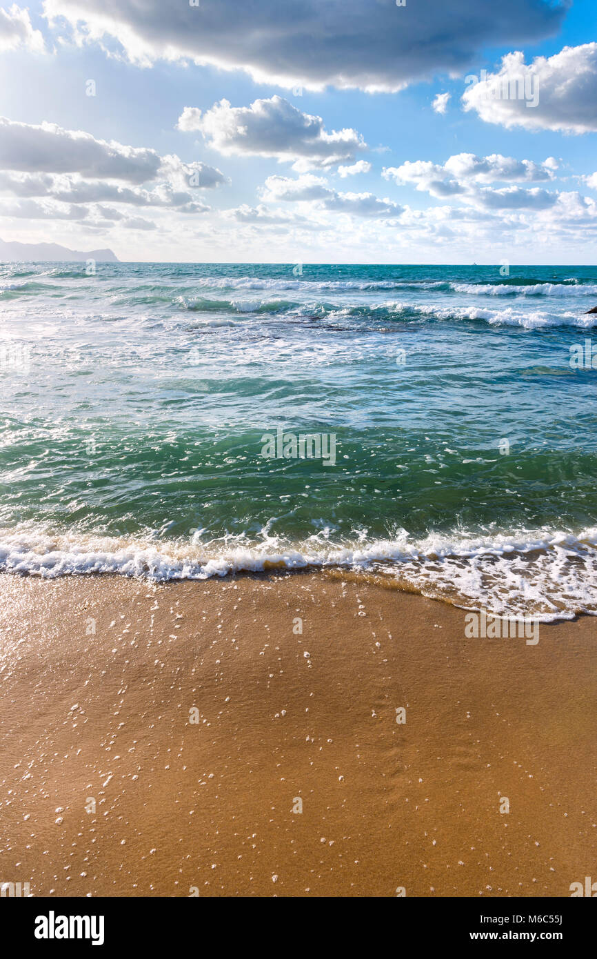 crystal clear sea and frothy waves on the beaches of Palermo in Sicily ...