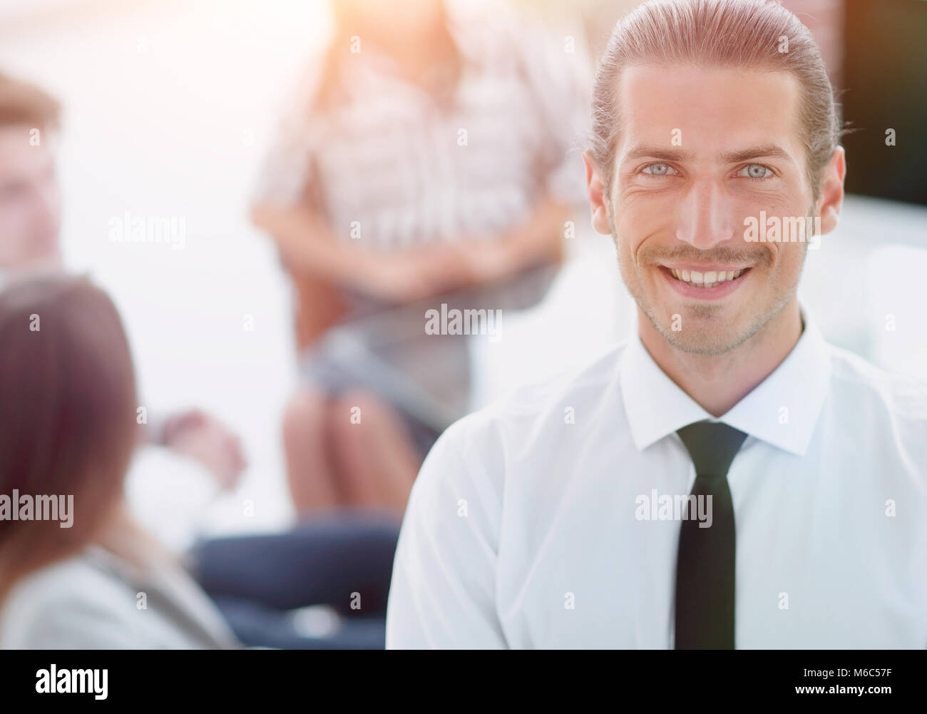 successful young business men on blurred background Stock Photo - Alamy