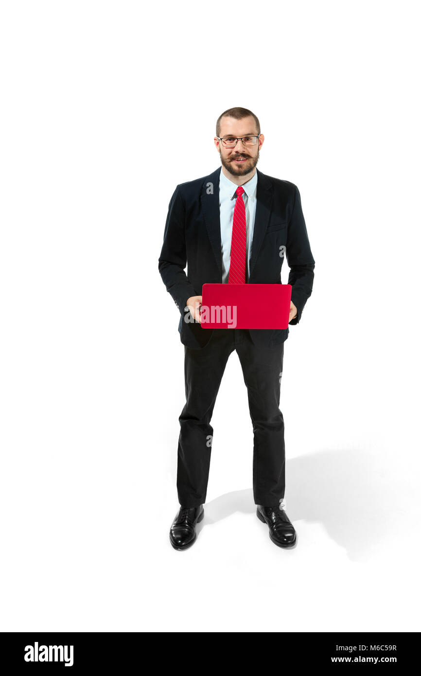 Picture of handsome young bearded man standing over white studio ...