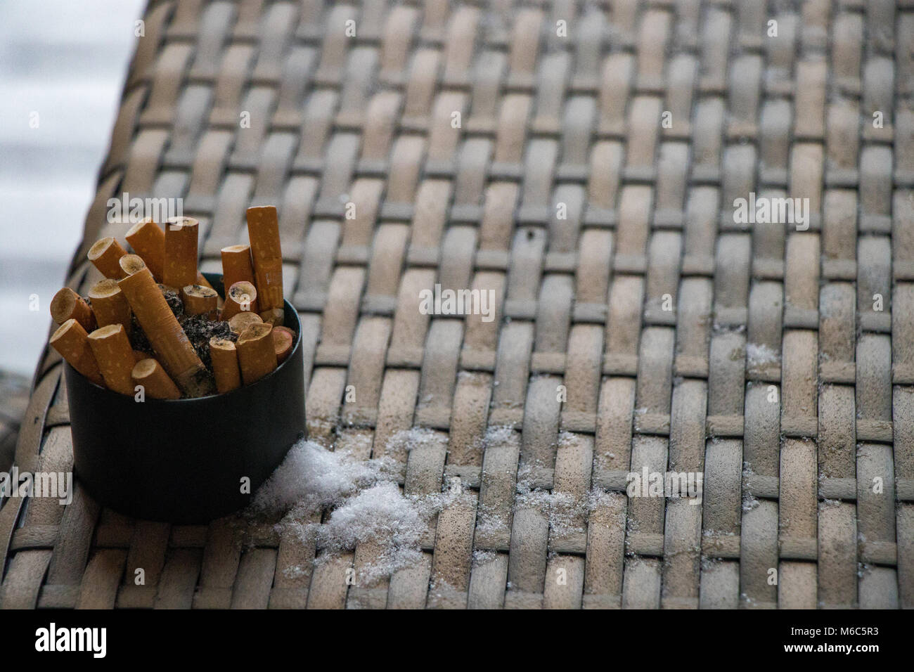 ashtray on the table in winter Stock Photo - Alamy