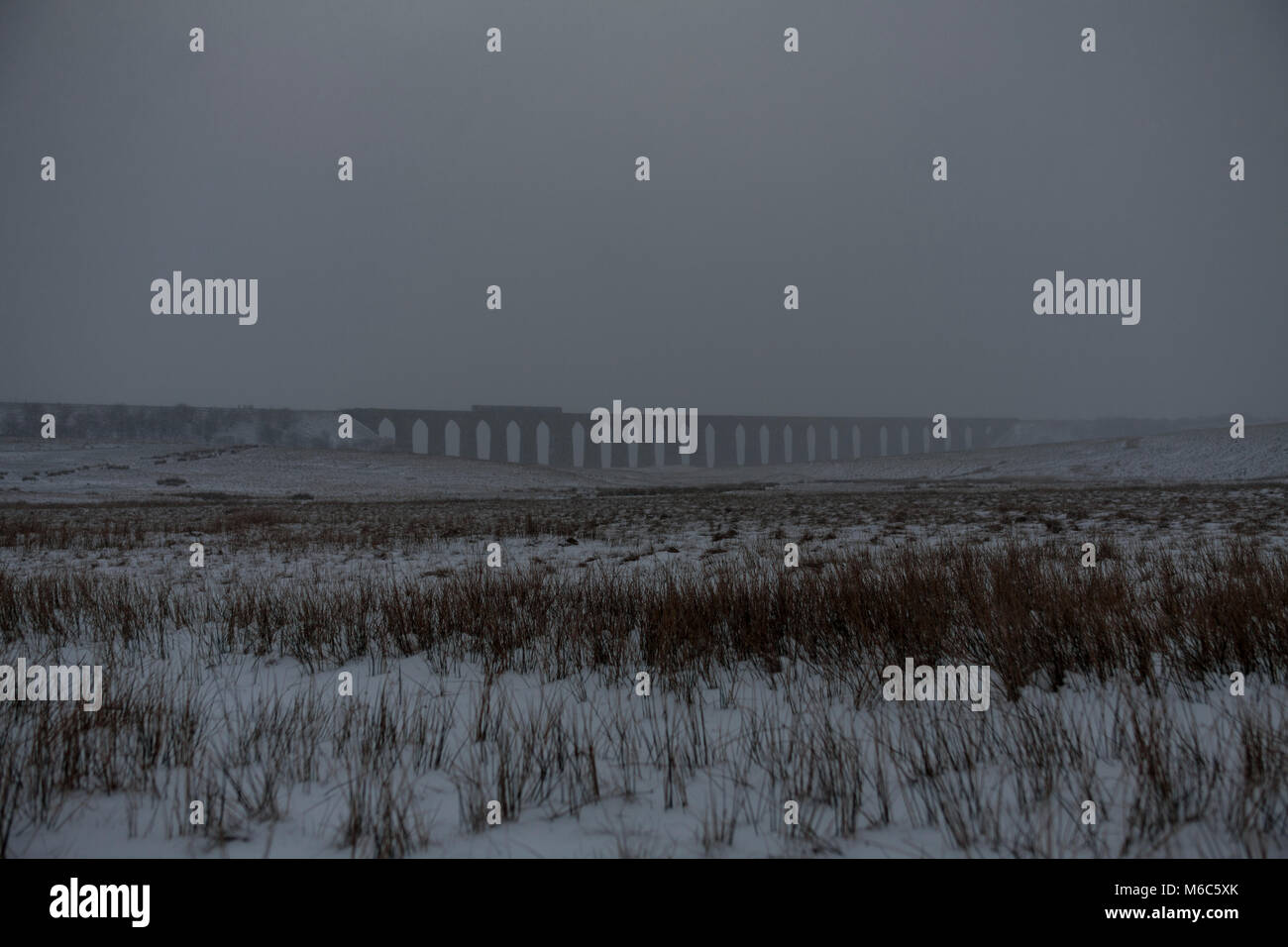 A Northern Rail class 158 express sprinter train crosses Ribblehead ...