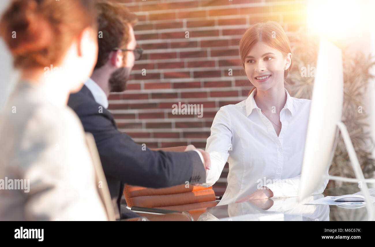 handshake Manager and the client in the office Stock Photo - Alamy