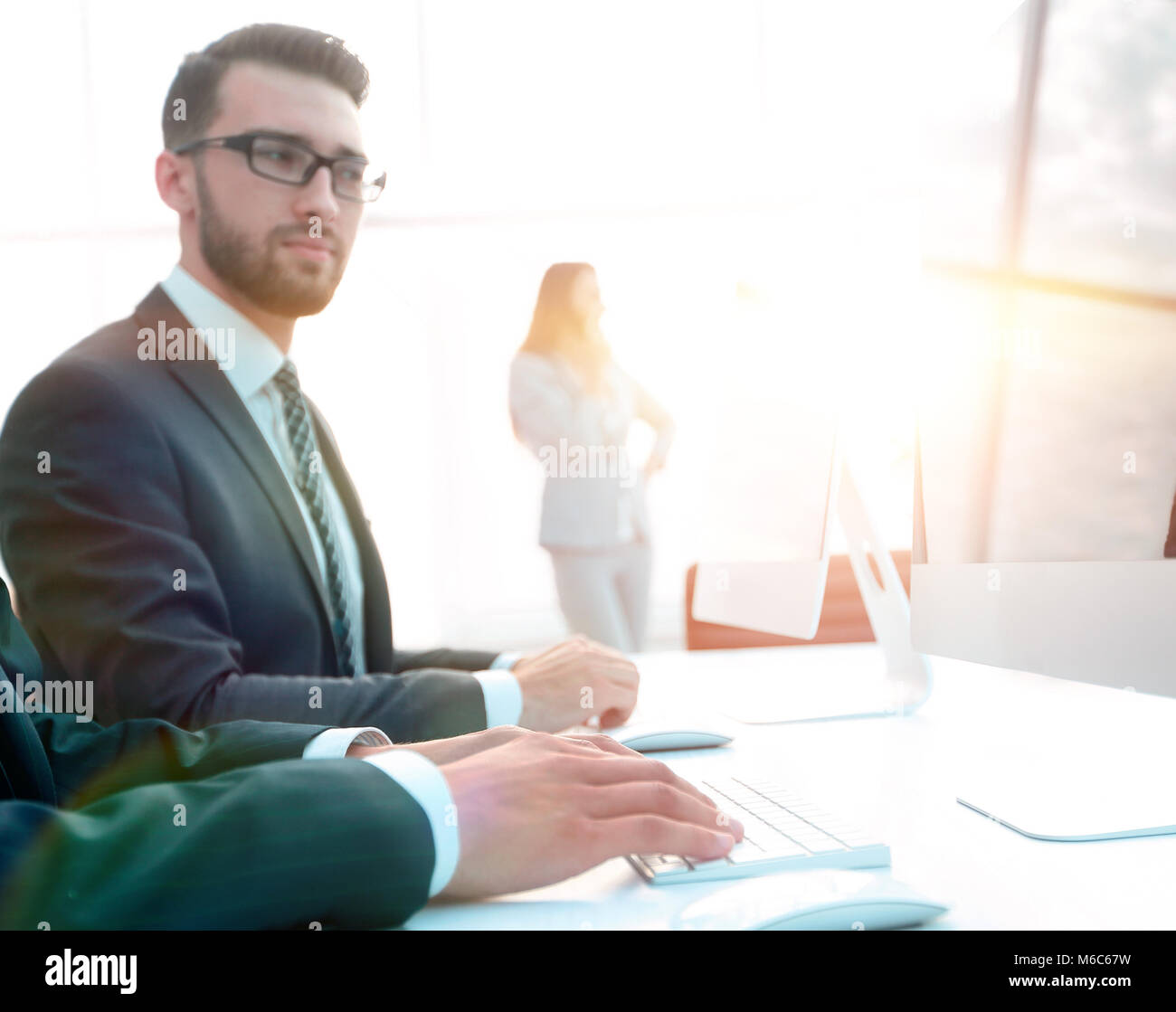 employee is typing on the computer keyboard Stock Photo - Alamy