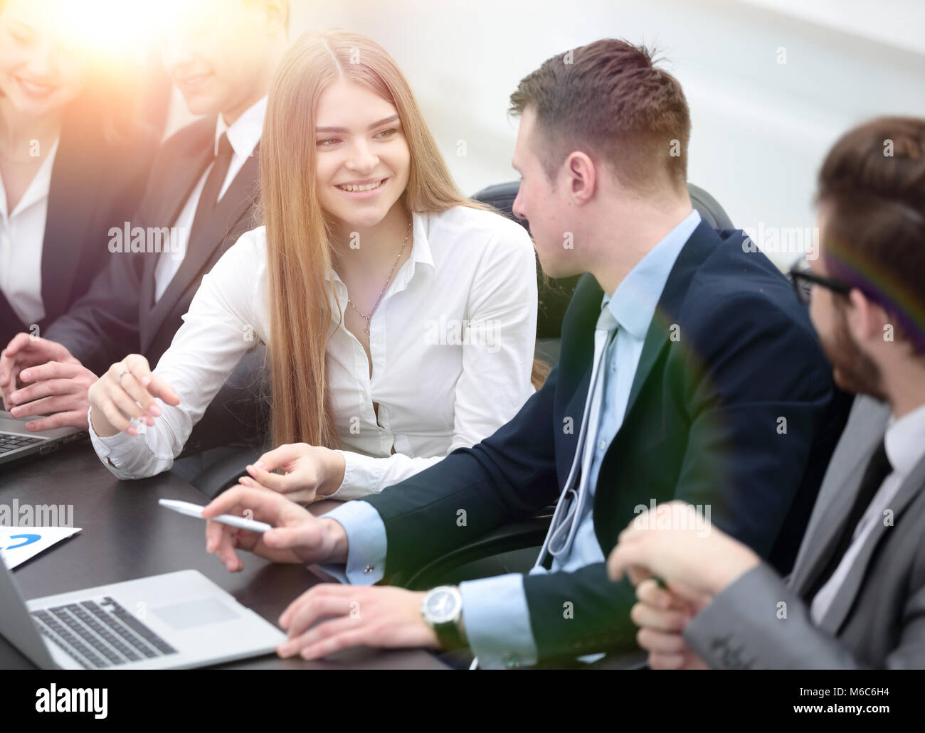 colleagues to discuss current issues at the Desk Stock Photo - Alamy