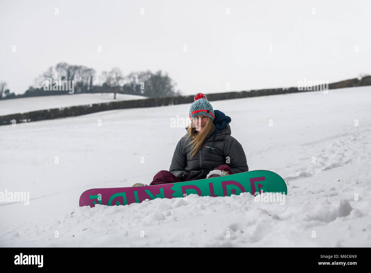 A female snowboarder makes the most of conditions on Solsbury Hill near ...