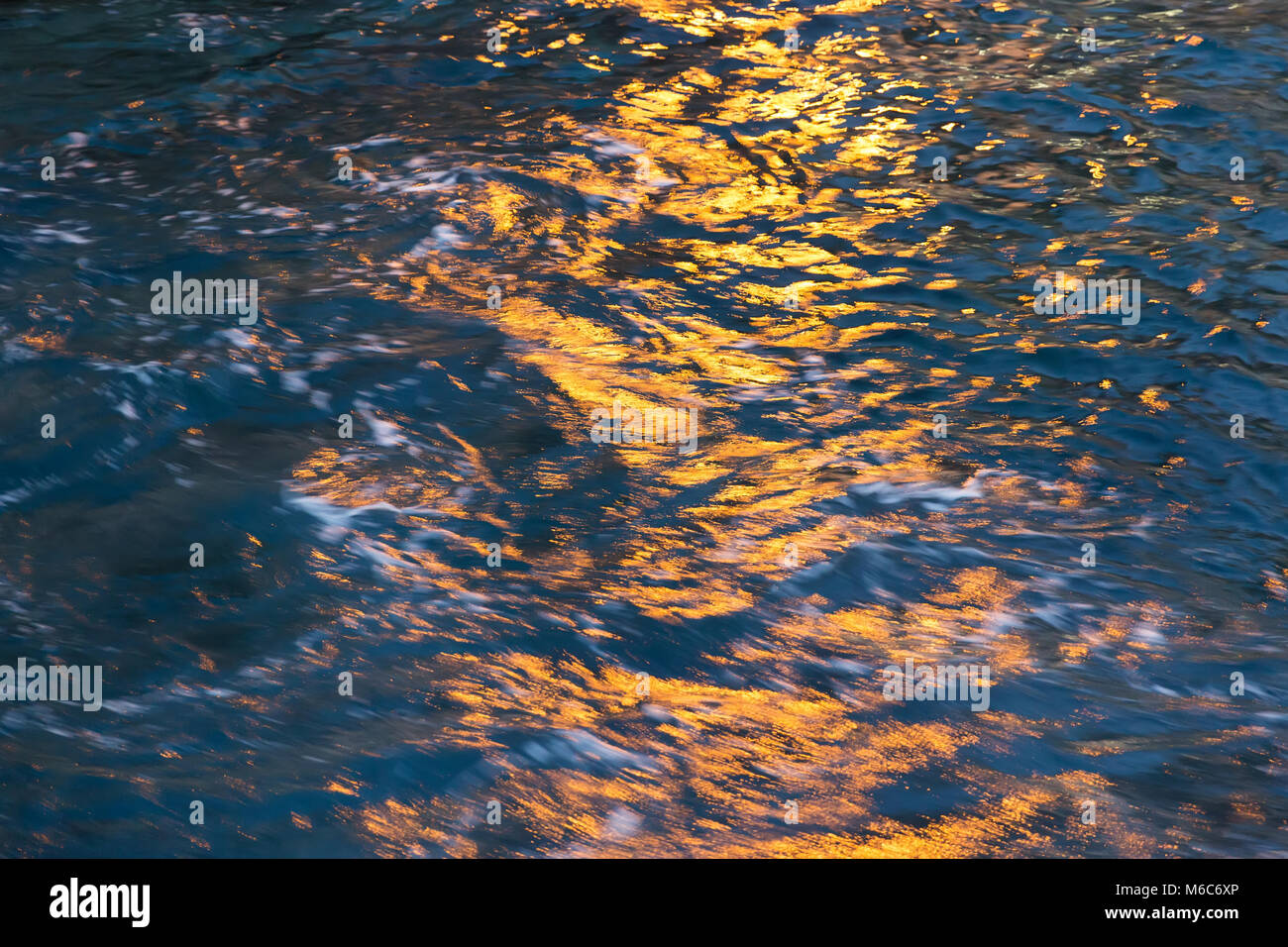 blurred reflection of light on the water Stock Photo - Alamy