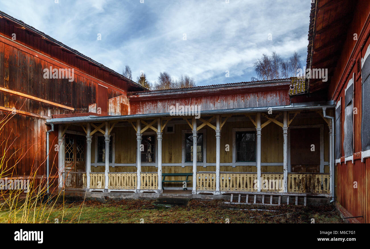 Old wooden building in red color Stock Photo - Alamy