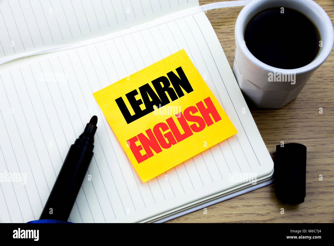 Hand writing text caption inspiration showing Learn English. Business ...