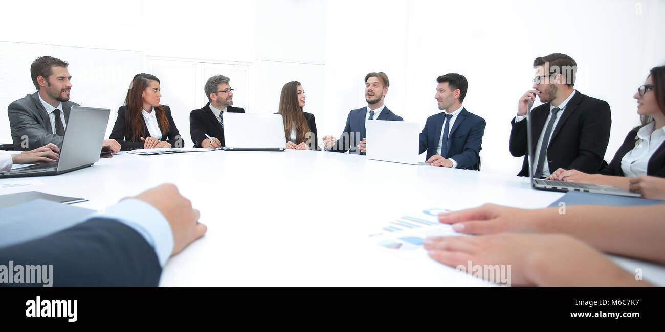 meeting business partners for round - table Stock Photo - Alamy