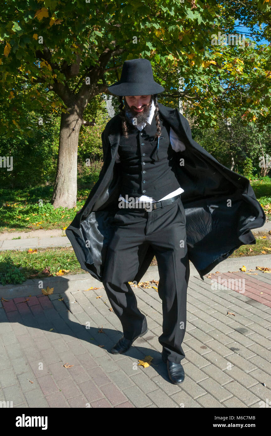 Outdoor sunny portrait of happy smiling traditional dancing orthodox ...