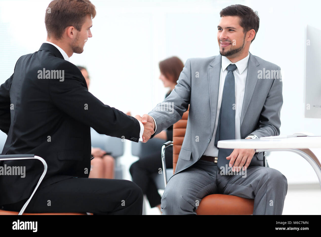 handshake Manager and the client in the office Stock Photo - Alamy