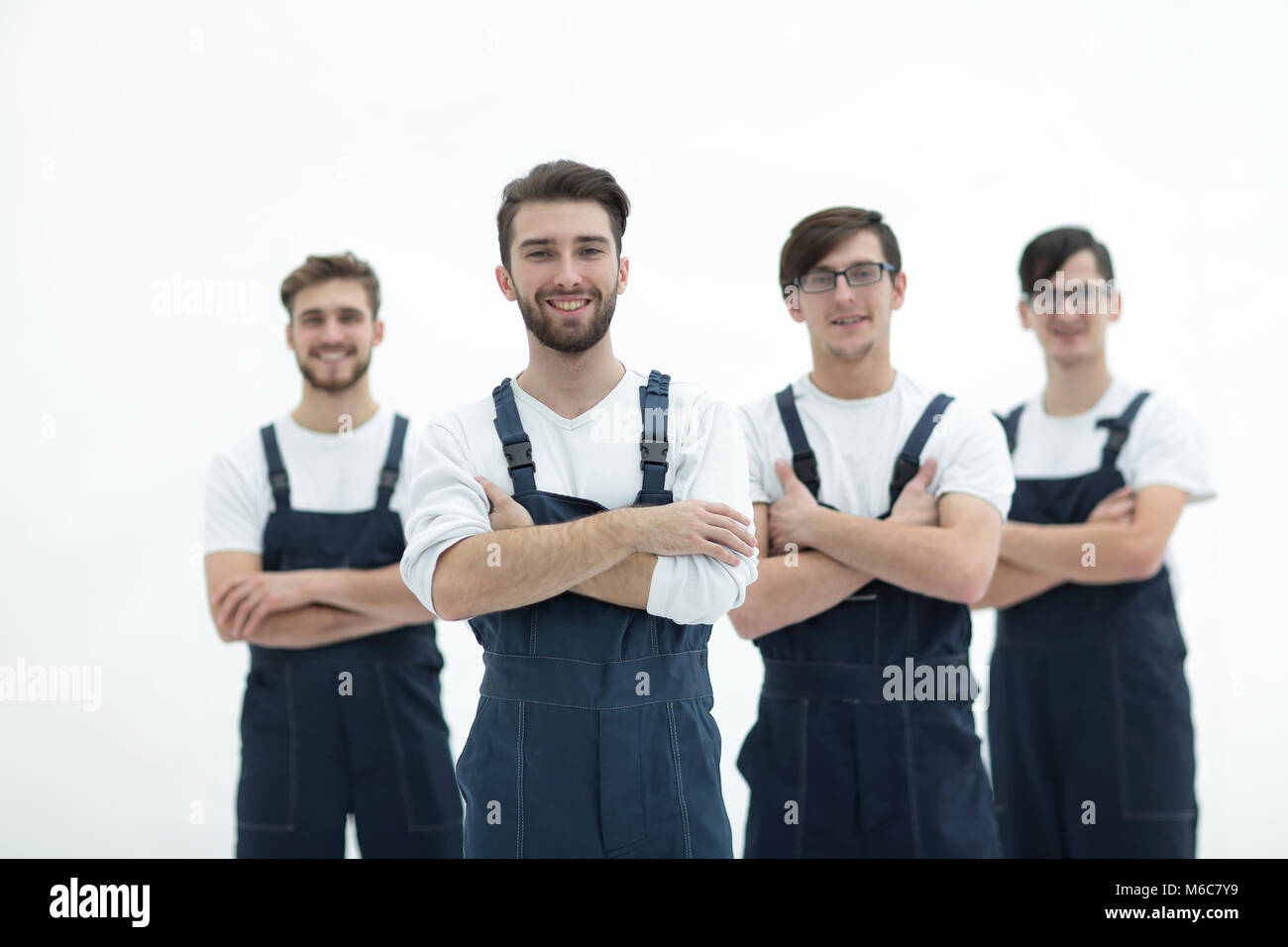 Happy team of responsible movers and their smiling leader Stock Photo ...