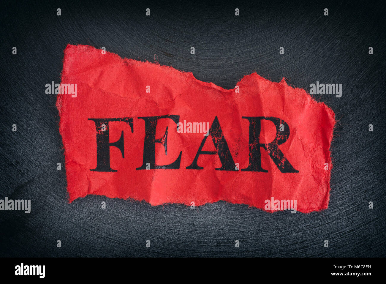 Crumpled piece of paper with the word Fear. Close up Stock Photo - Alamy