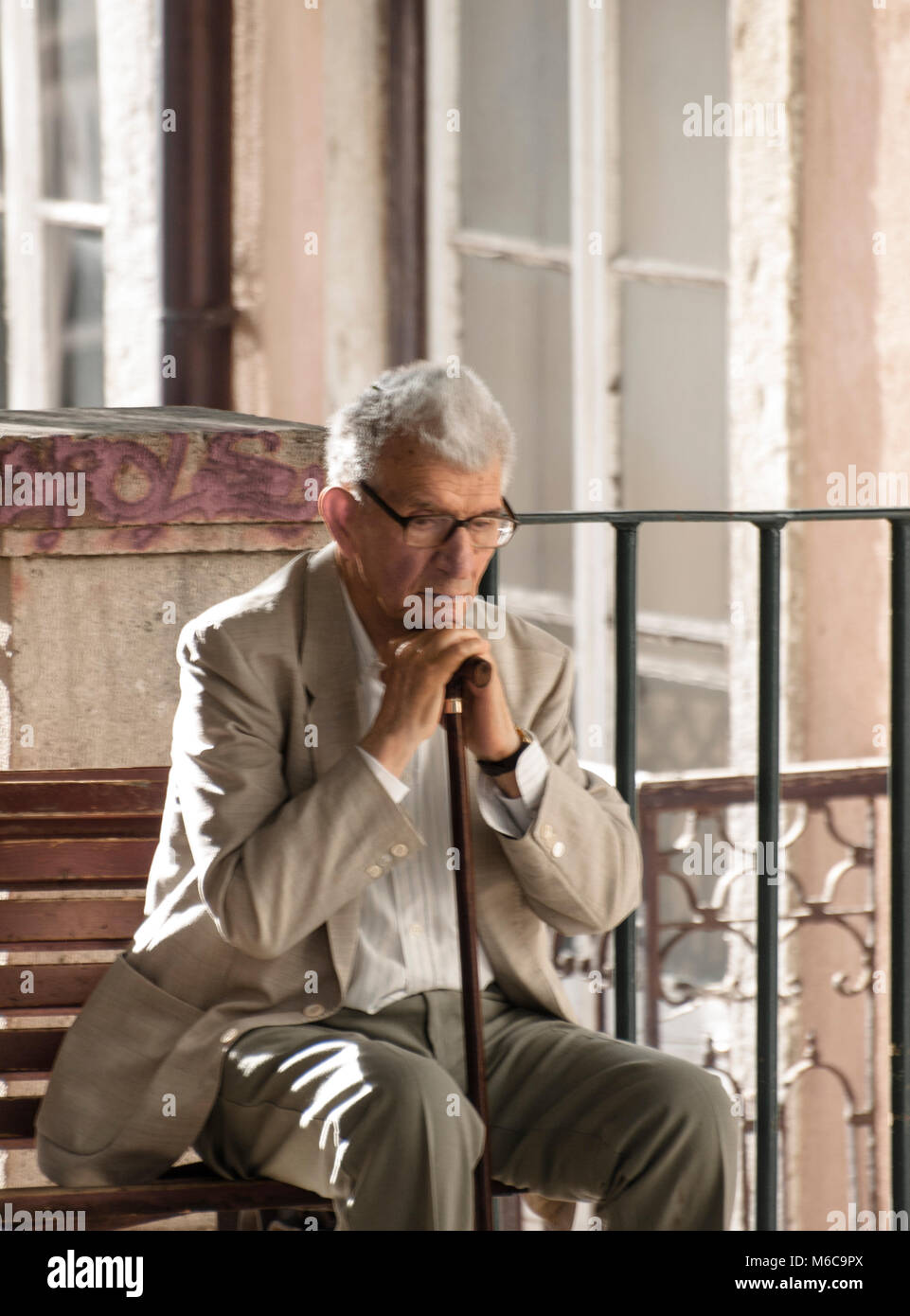 senior man sitting on bench Stock Photo - Alamy