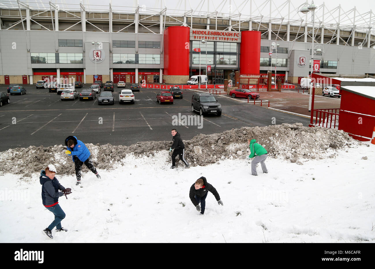 Children enjoy the snow outside Middlesbrough's Riverside Stadium ...