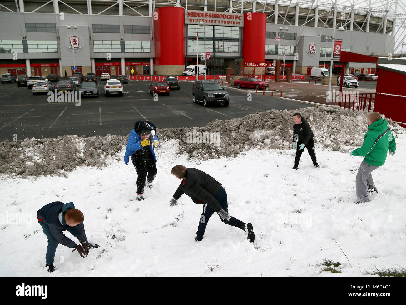 Children enjoy the snow outside Middlesbrough's Riverside Stadium ...