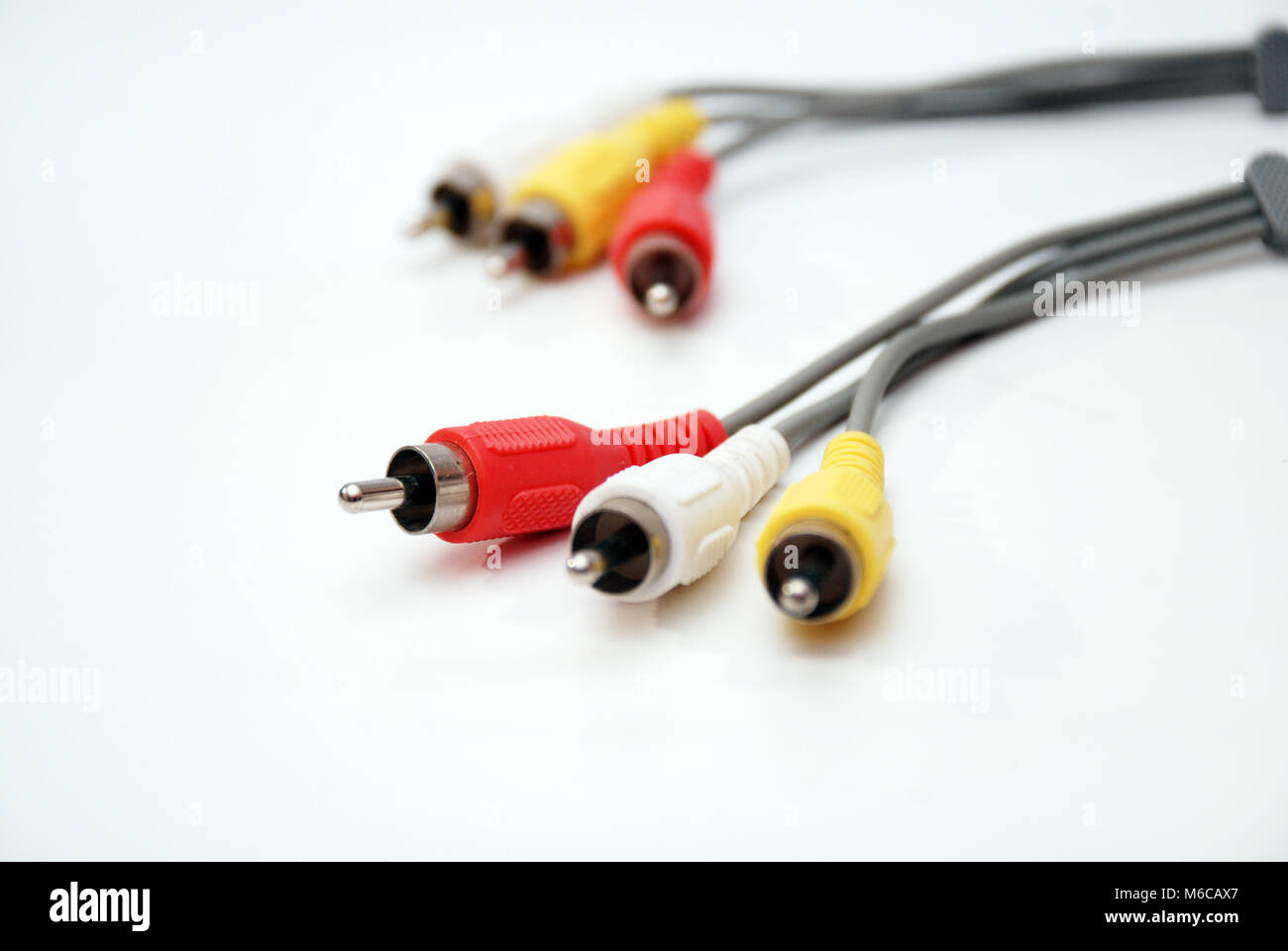 Audio video cables on a white background Stock Photo - Alamy