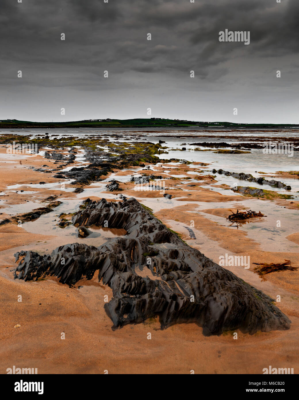 Rocks in the sand at Doonbeg beach, Ireland Stock Photo - Alamy