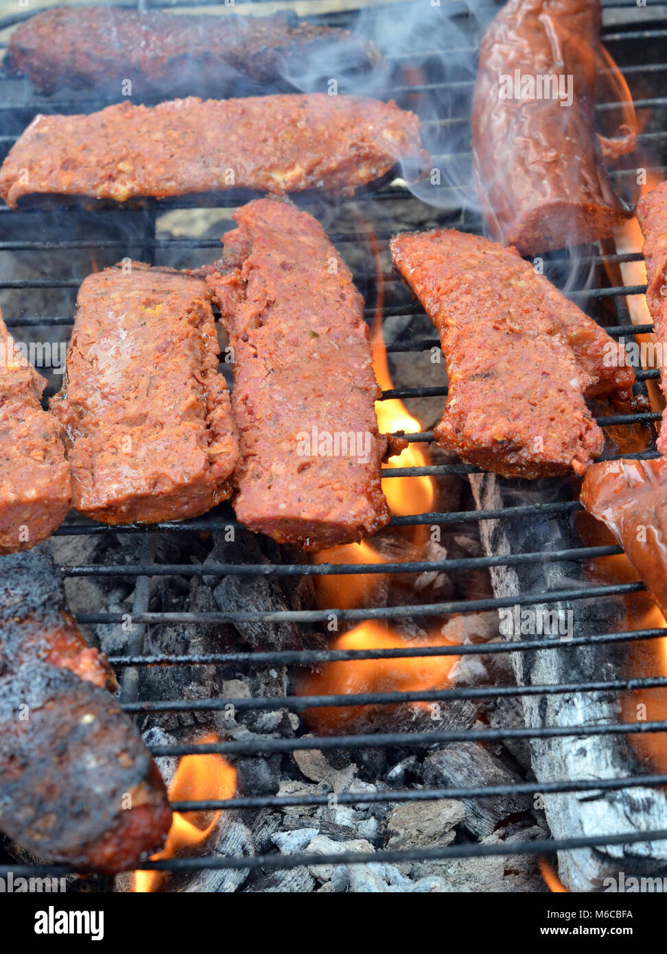 Picture of a Fat Sausage on a grill, Food concept Stock Photo - Alamy