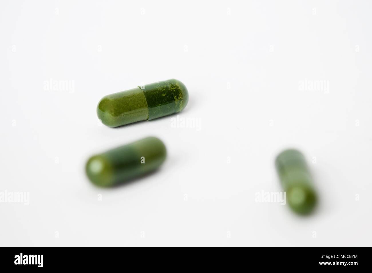 Capsules and tablets on white background Stock Photo - Alamy