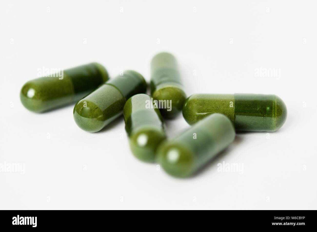 Capsules and tablets on white background Stock Photo - Alamy