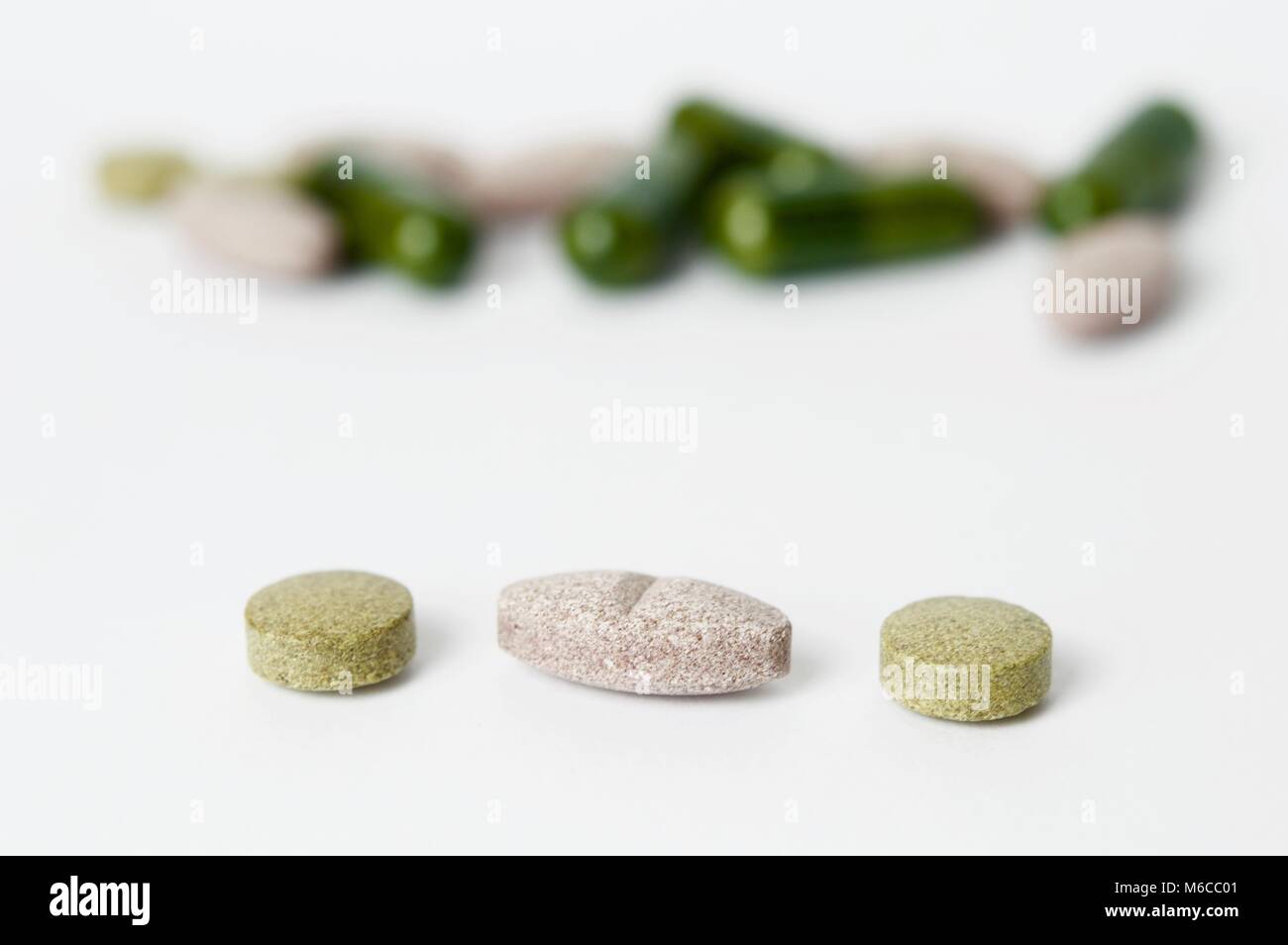 Capsules and tablets on white background Stock Photo - Alamy