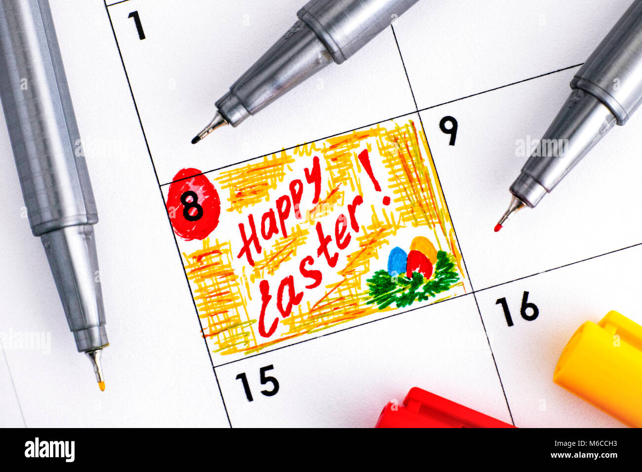 Reminder Happy Easter in calendar with coloured pens. Close-up Stock ...