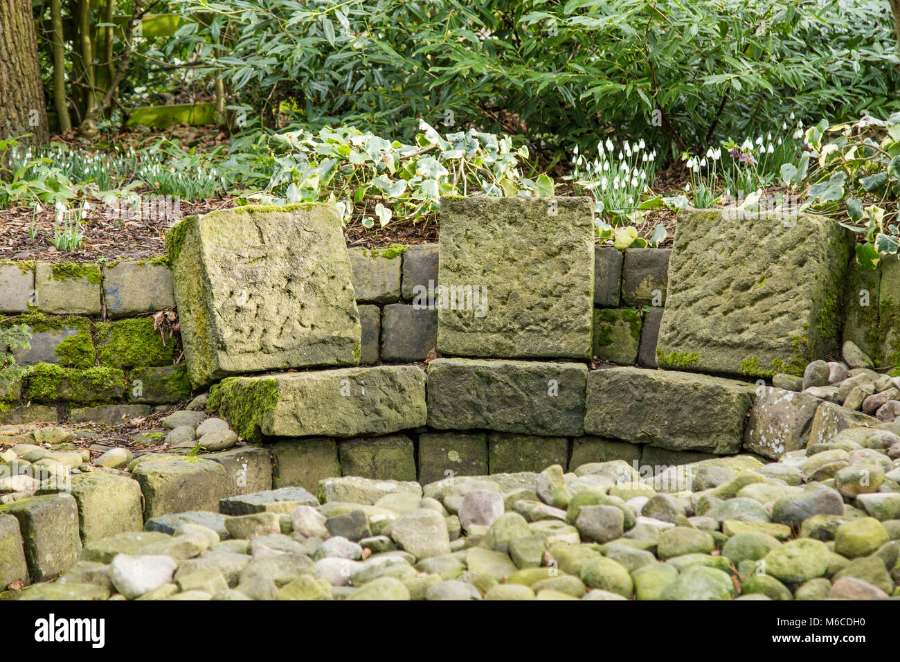 Stone garden seating Stock Photo - Alamy