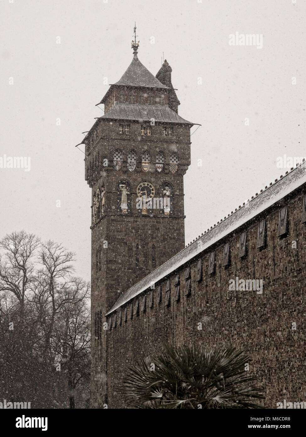 Cardiff Castle Clock Tower in falling snow Stock Photo - Alamy