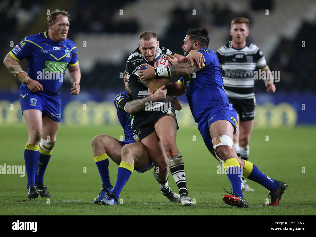 Hull FC's Dean Hadley is tackled by Warrington Wolves Ben Murdoch ...