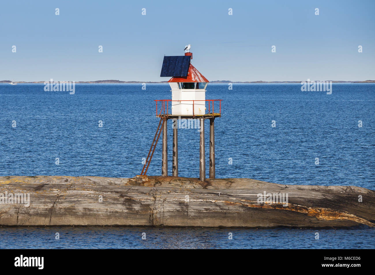 Traditional Norwegian steel lighthouse tower with solar battery and ...