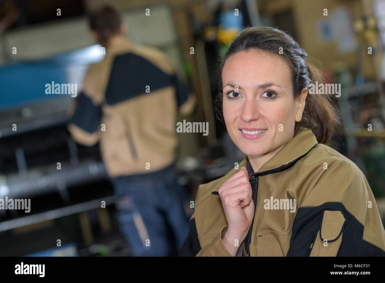 happy factory employee posing in the workshop Stock Photo - Alamy