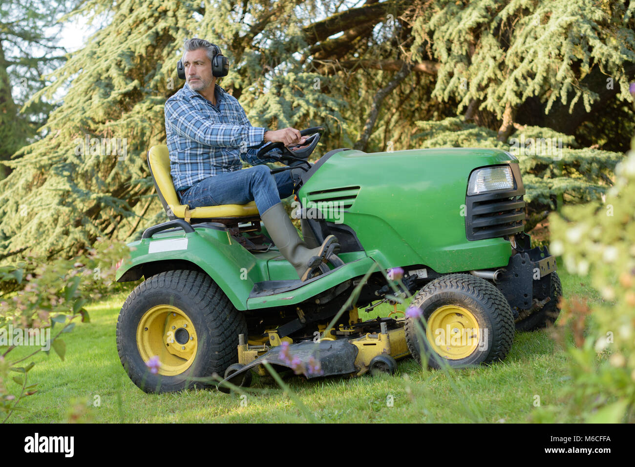 careless garden worker Stock Photo - Alamy