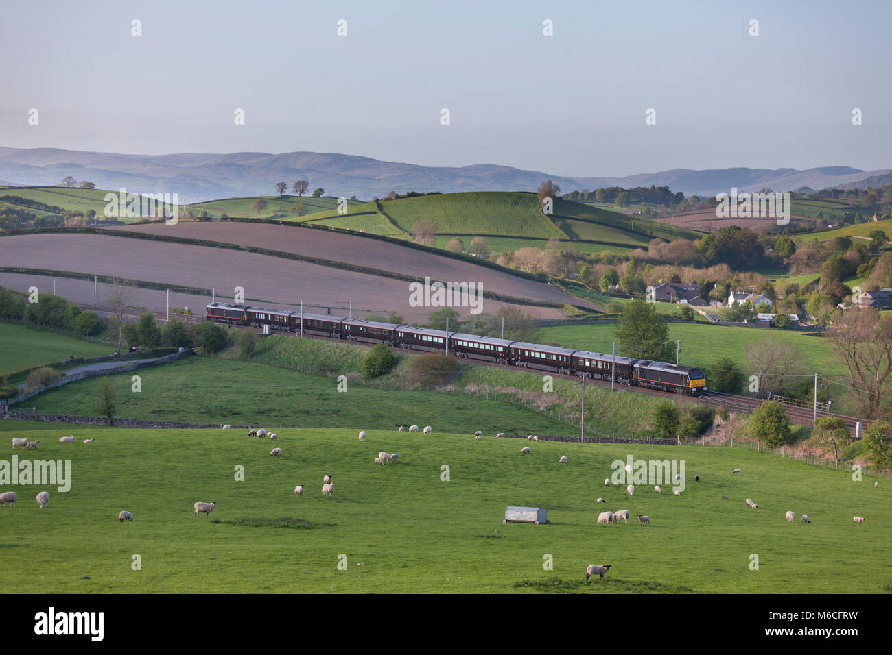 The British royal train passes Milnthorpe on the west coast main line ...