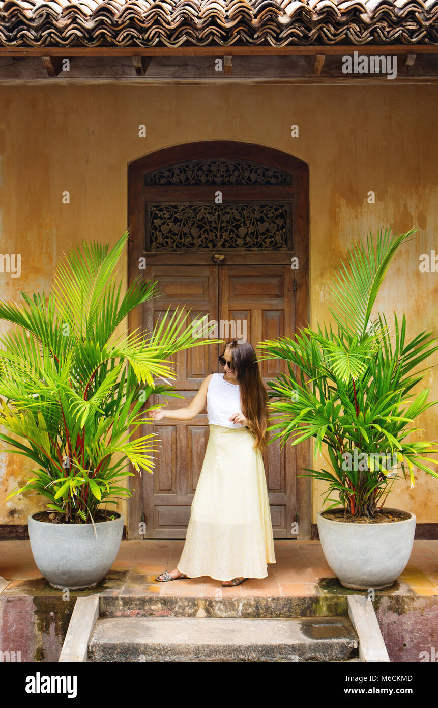 Woman near the palm trees Stock Photo - Alamy