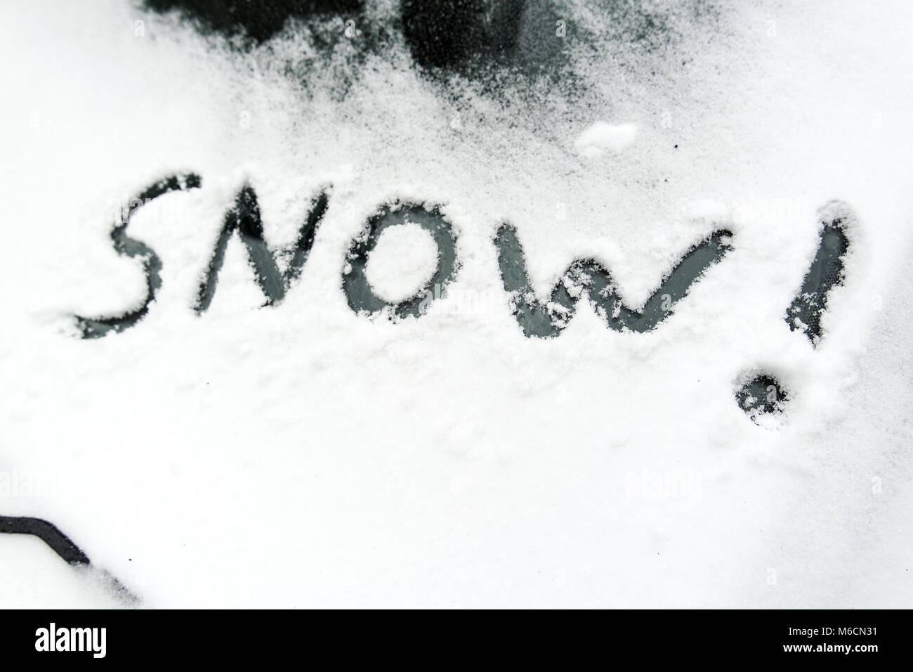 Snow background: Snow written on a car window after winter blizzard ...
