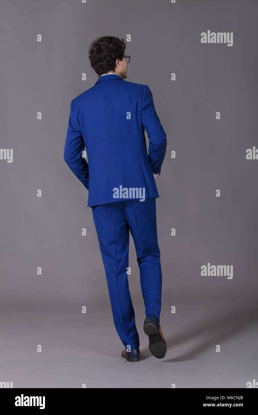 Back standing man making step Stock Photo - Alamy