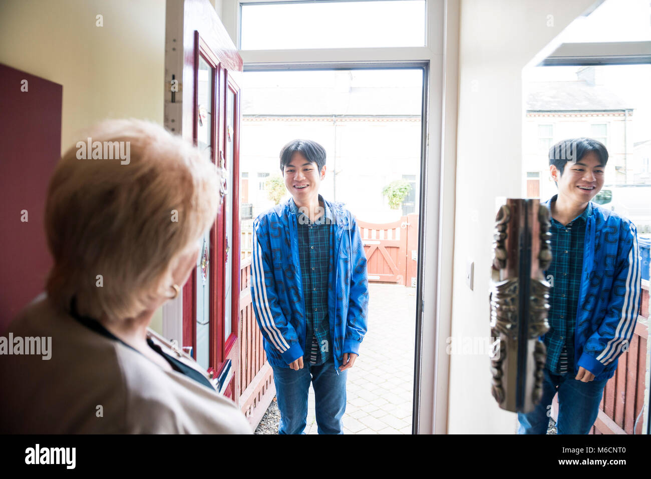 an international overseas student lets himself into his student let ...