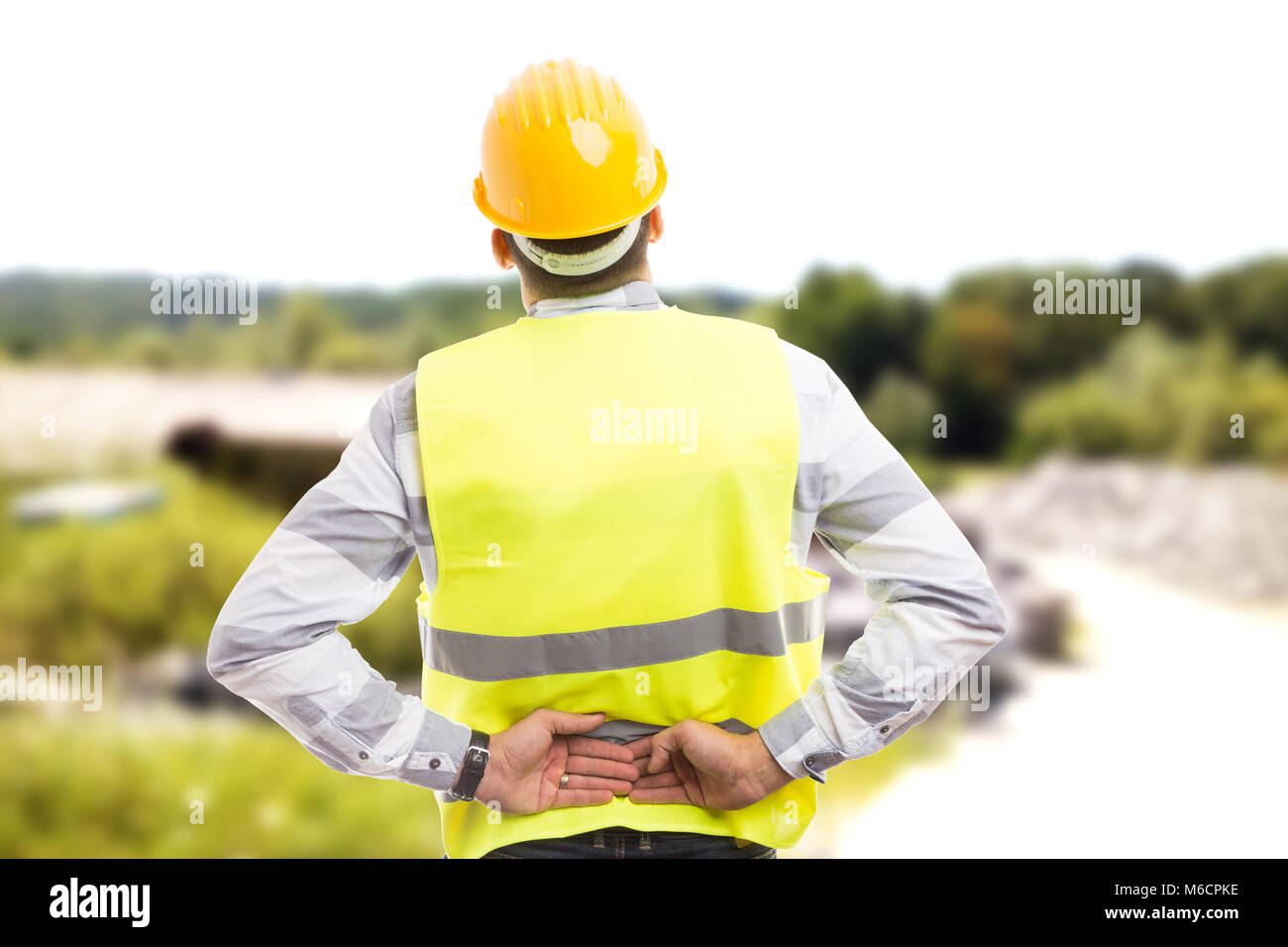 Injured construction worker or engineer suffering backpain in lower ...