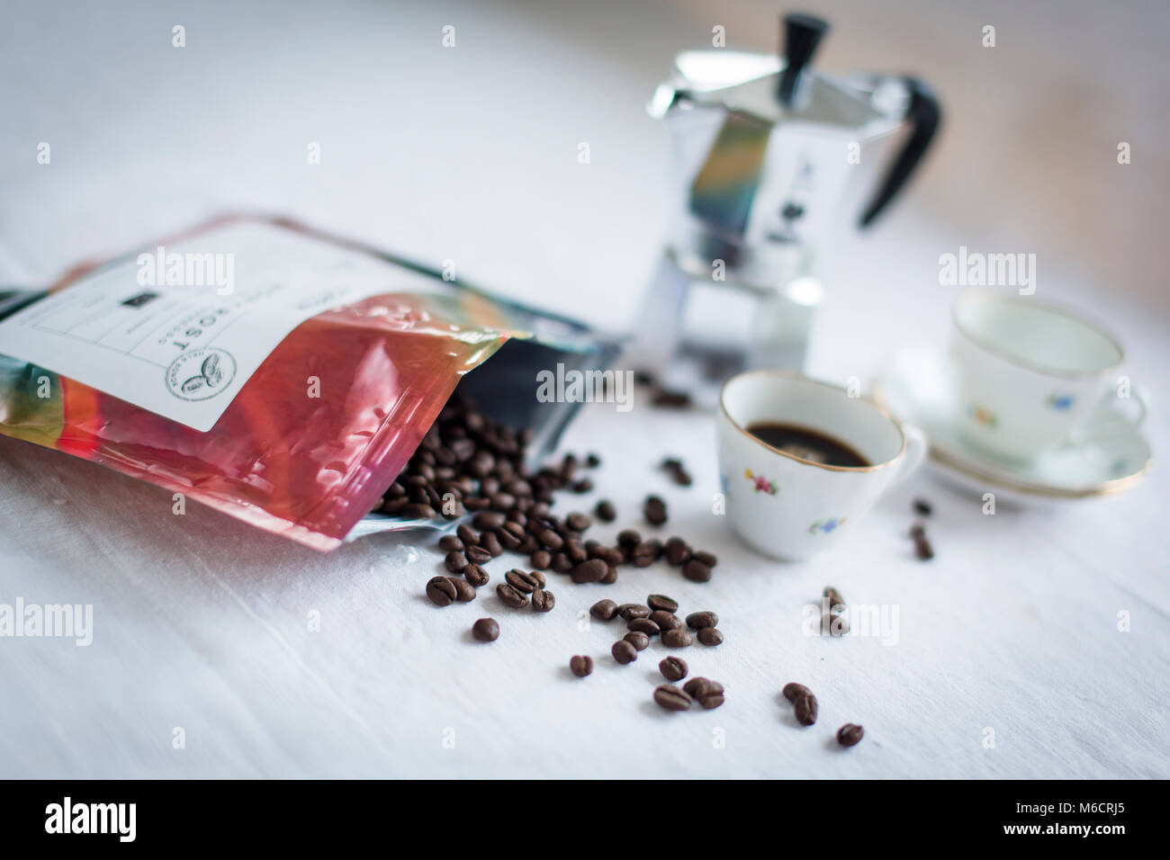 Classic italian espresso can with coffee cup and coffee beans on a ...