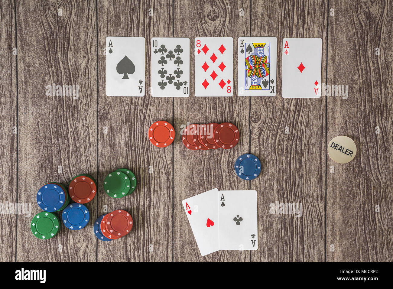 Poker theme wood table with cards and chips Stock Photo - Alamy