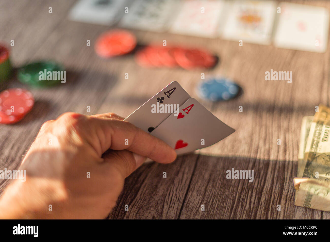 Poker theme wood table with cards and chips Stock Photo - Alamy