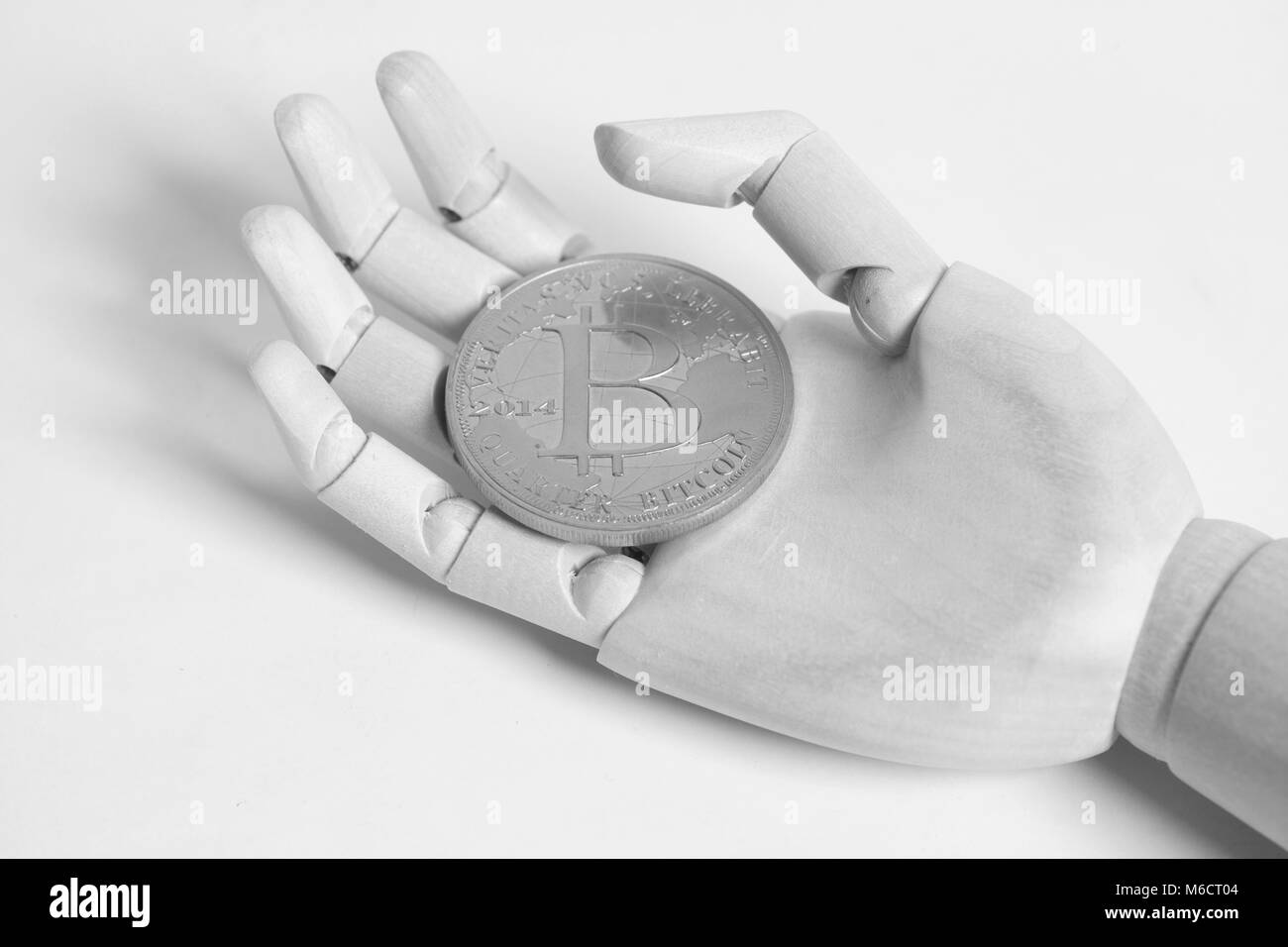 Robot hand holding money Black and White Stock Photos & Images - Alamy
