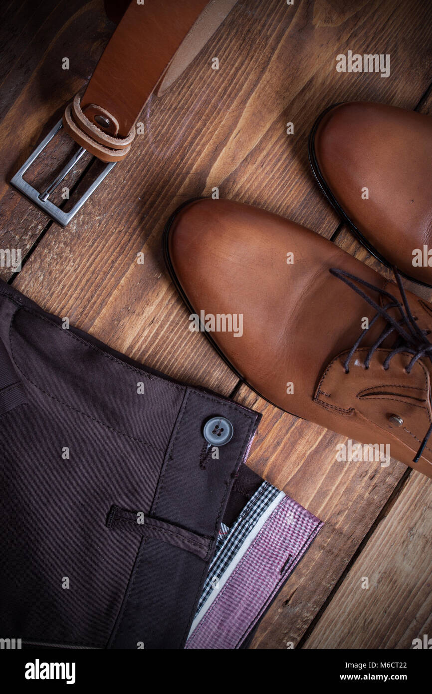 Collage of modern men's clothing on a brown wooden background Stock ...