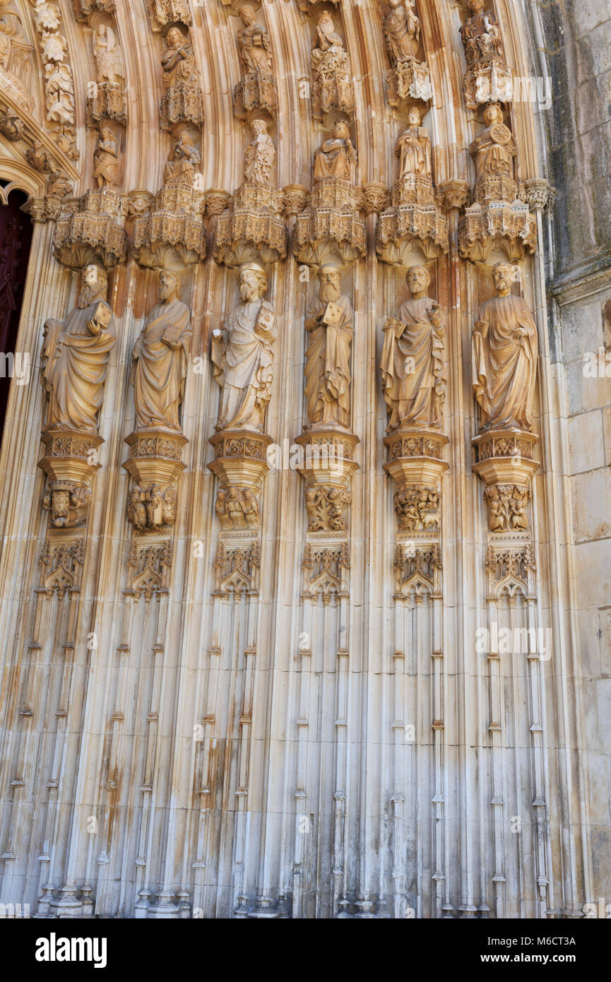 Religious stone carvings figures at the entrance of Santa Maria da ...